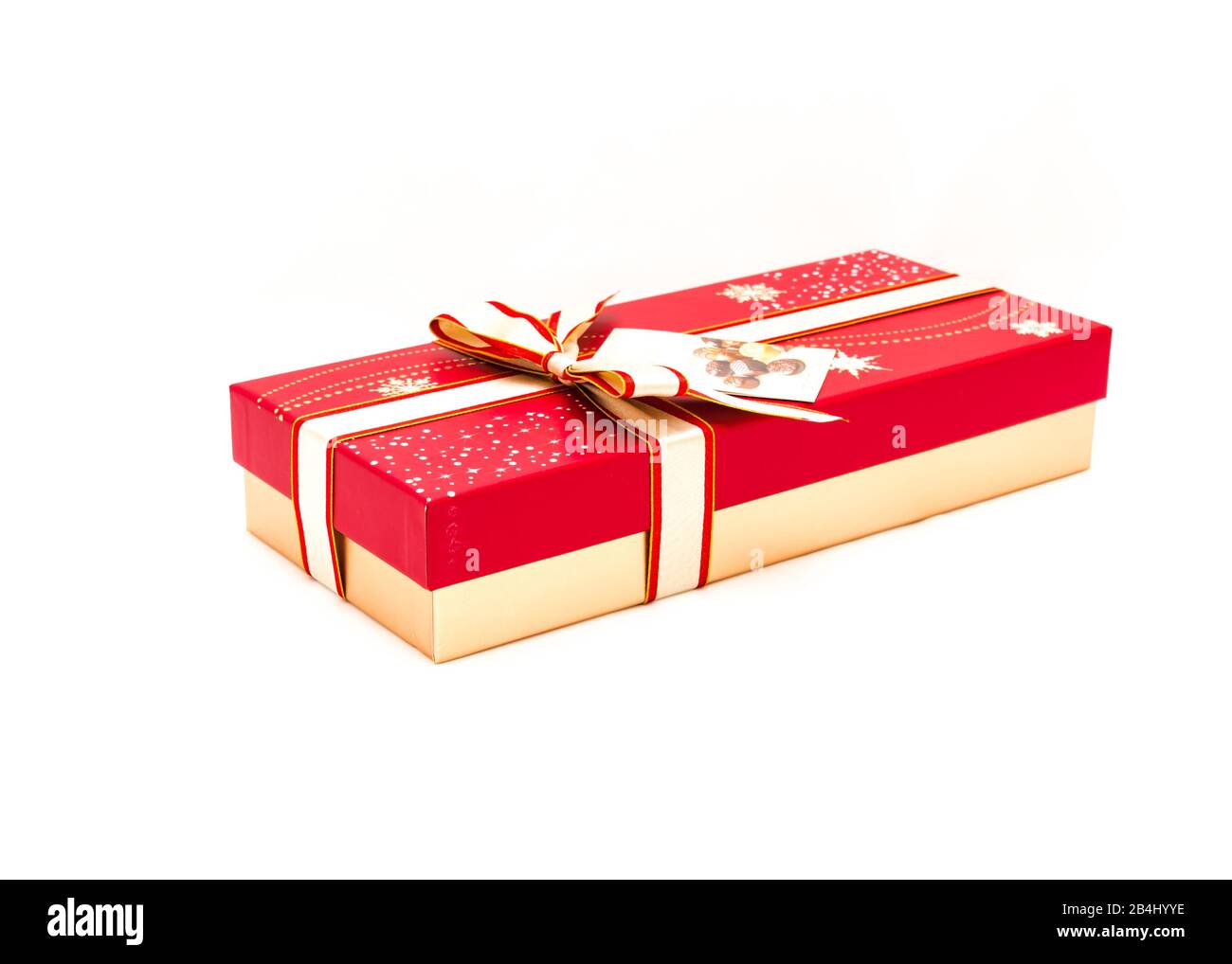 Red chocolate box with tag label and red yellow bow ribbon isolated on ...