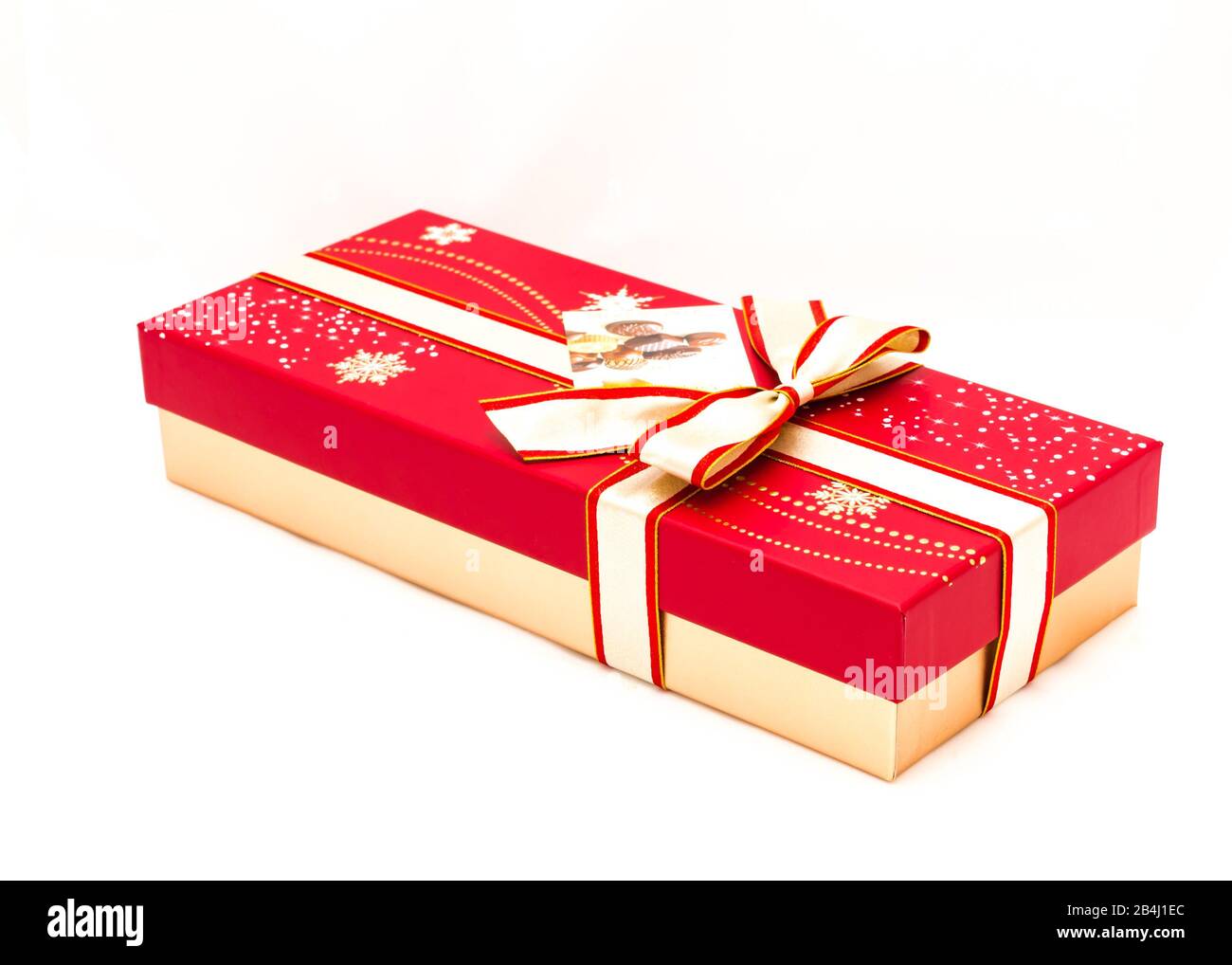 Red chocolate box with tag label and red yellow bow ribbon isolated on ...