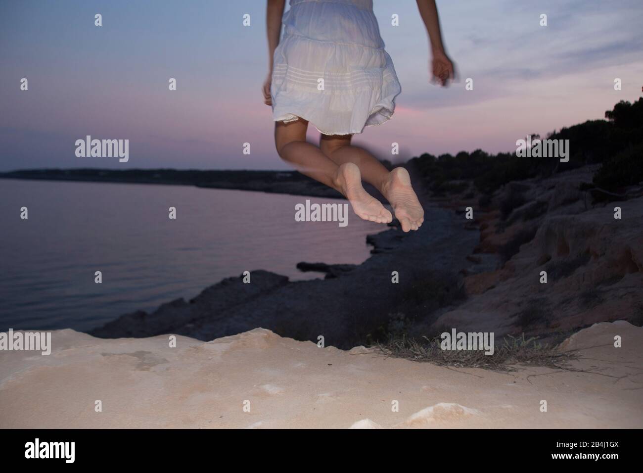 Legs, bounce, dusk, sea Stock Photo - Alamy
