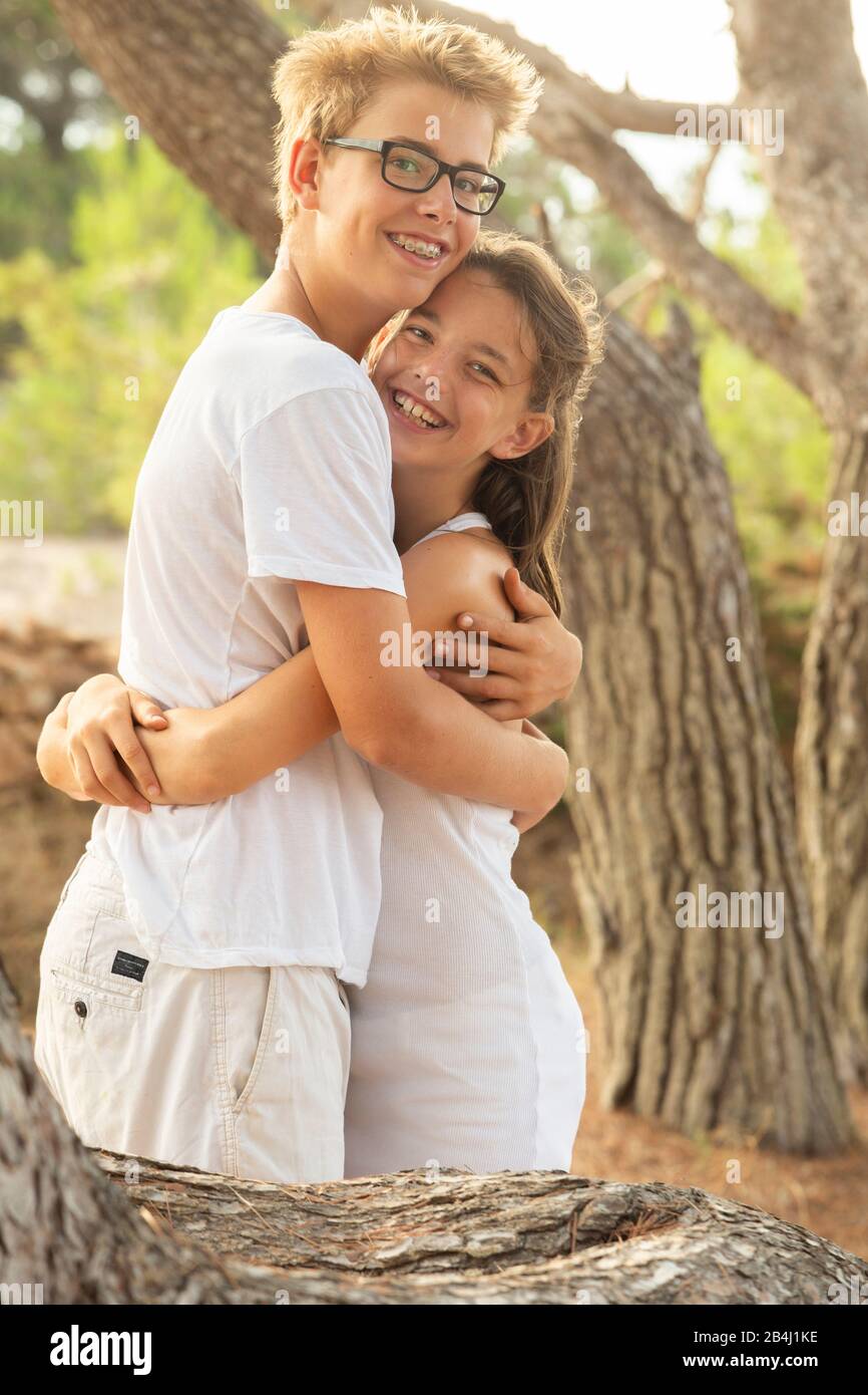 hug, siblings, forest Stock Photo - Alamy
