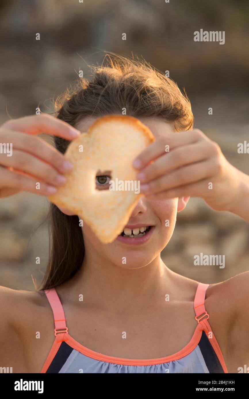 Toast, hole, girl Stock Photo - Alamy