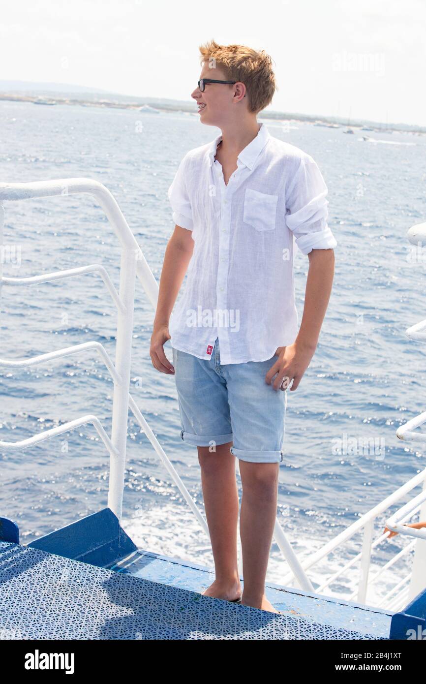 Boy, standing, boat, ship Stock Photo - Alamy