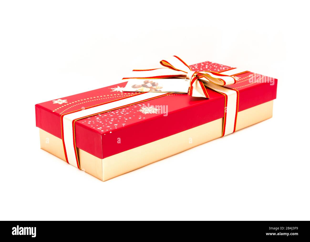 Red chocolate box with tag label and red yellow bow ribbon isolated on ...