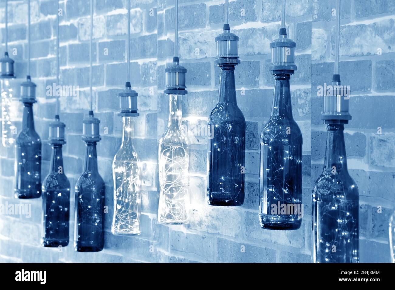 Bottle shape Energy efficient wall lampat the exhibition Stock Photo ...