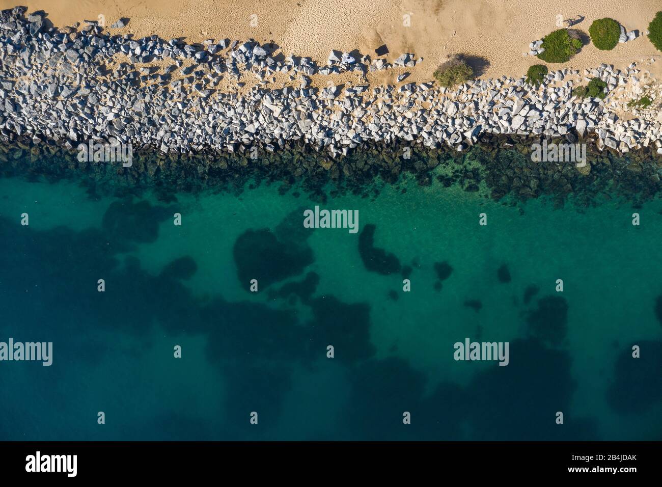 Low Altitude photo looking down at an extremely rocky beach Stock Photo ...