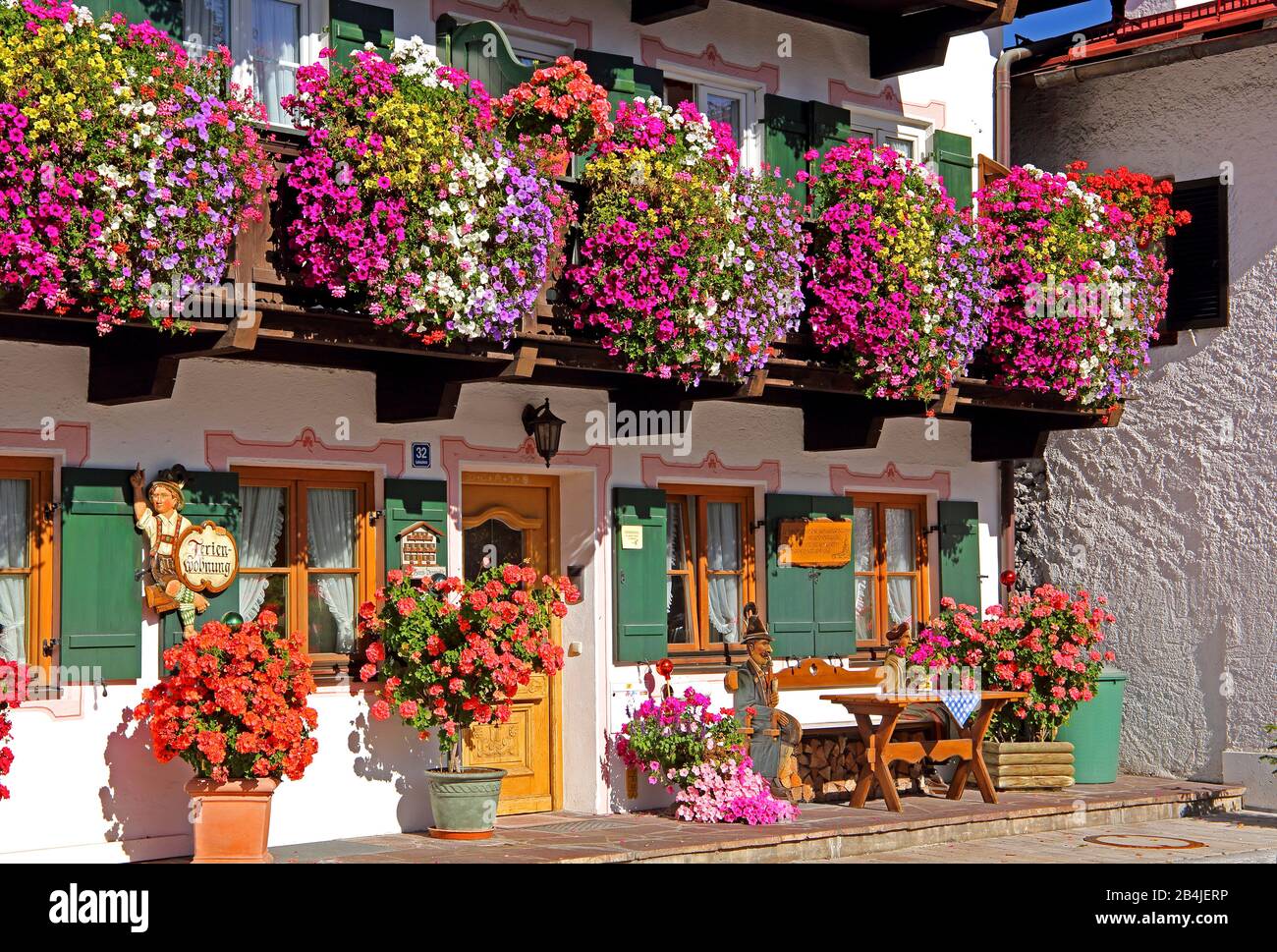 Traditional Upper Bavarian house with flower balconies, Garmisch ...