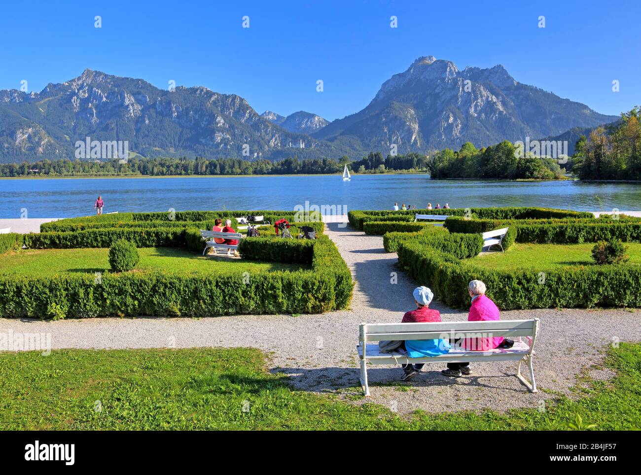 Garden of the festspielhaus am forggensee against neuschwanstein castle ...