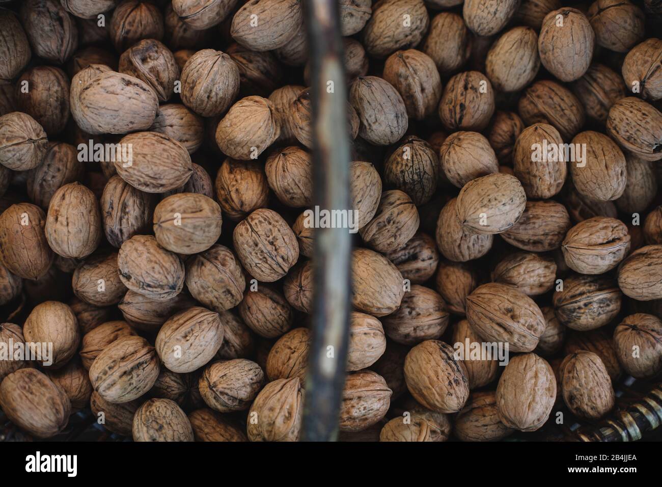 Lots of walnuts on market stall for sale Stock Photo - Alamy