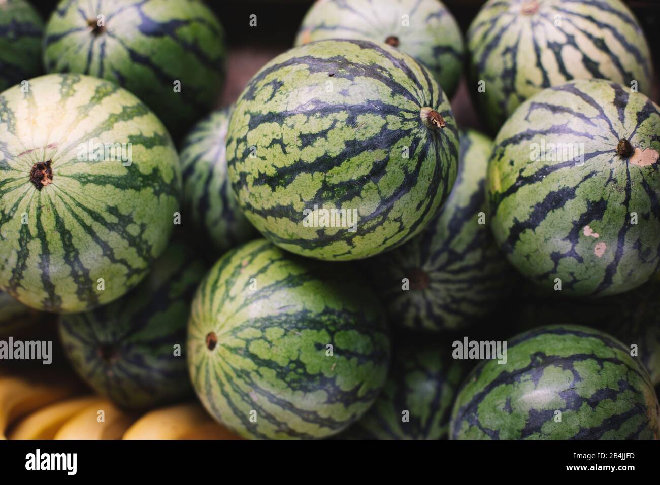 Watermelons on pile for sale, close-up Stock Photo - Alamy
