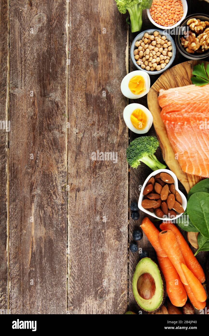 healthy eating and diet concept - natural rich in protein food on table ...