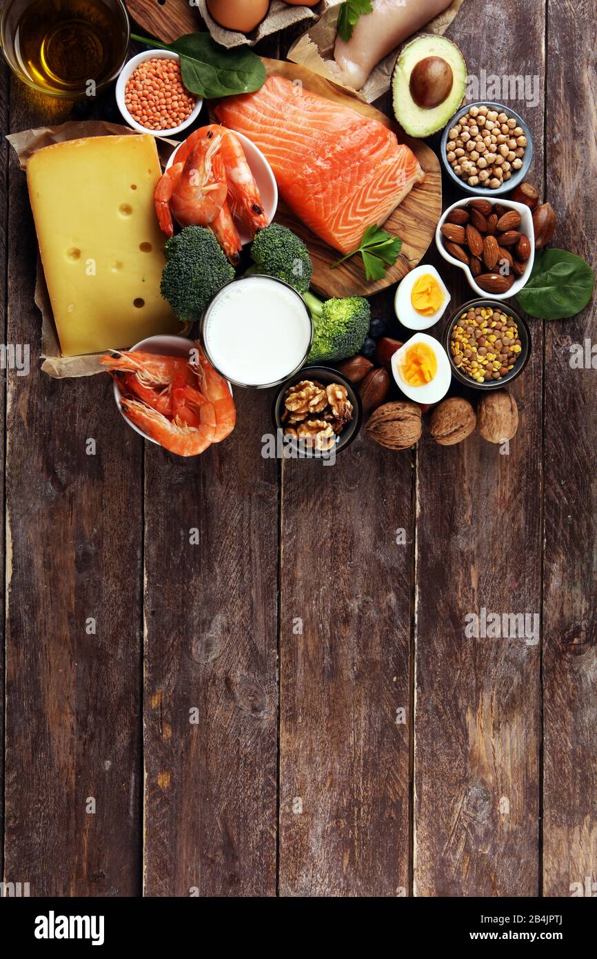 healthy eating and diet concept - natural rich in protein food on table ...