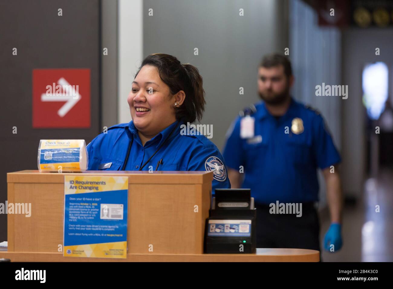 A TSA agent screens a passenger at a security checkpoint in the Central ...