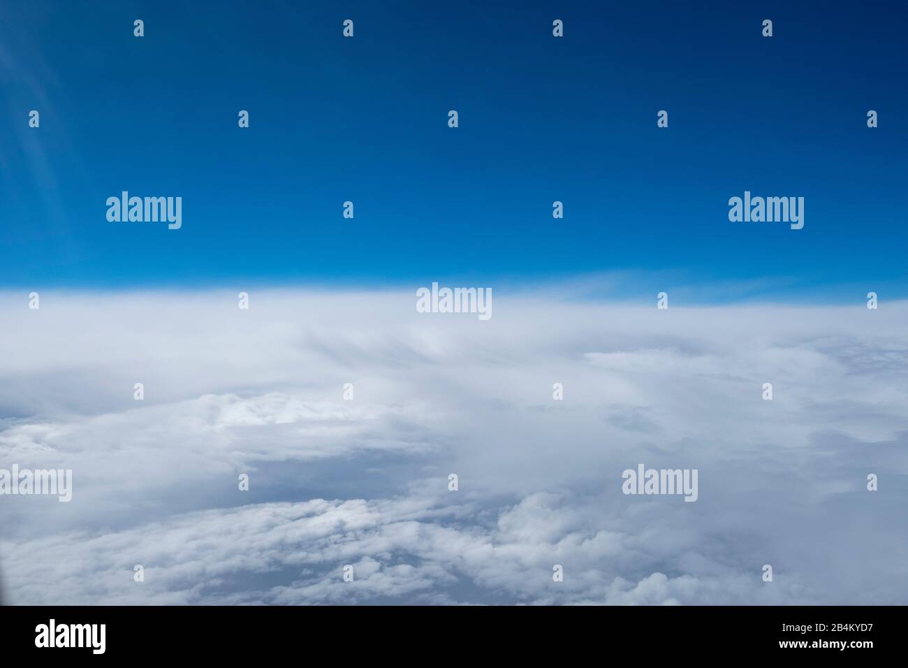 Closed cloud cover under blue sky, aerial view Stock Photo - Alamy