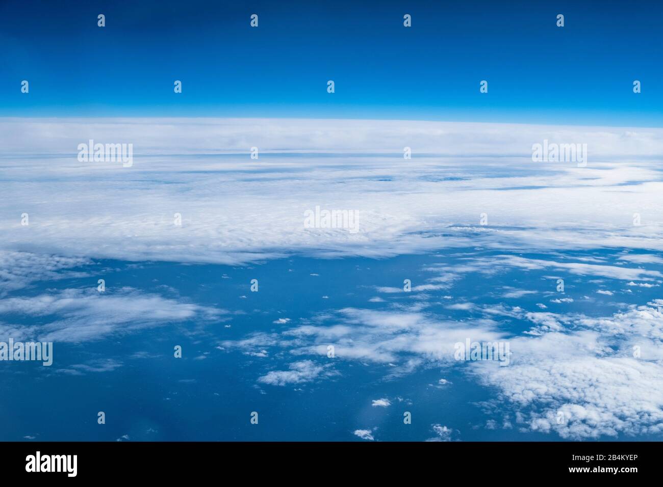 Blue sky clouds plane time hi-res stock photography and images - Alamy