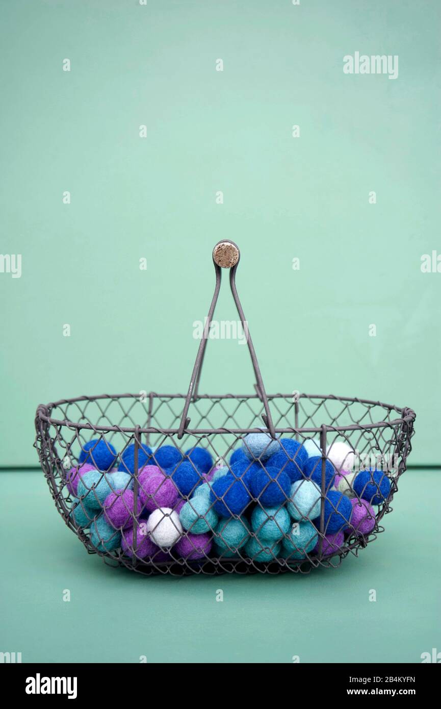 Handmade / handicrafts, wire basket with colorful felt balls Stock ...