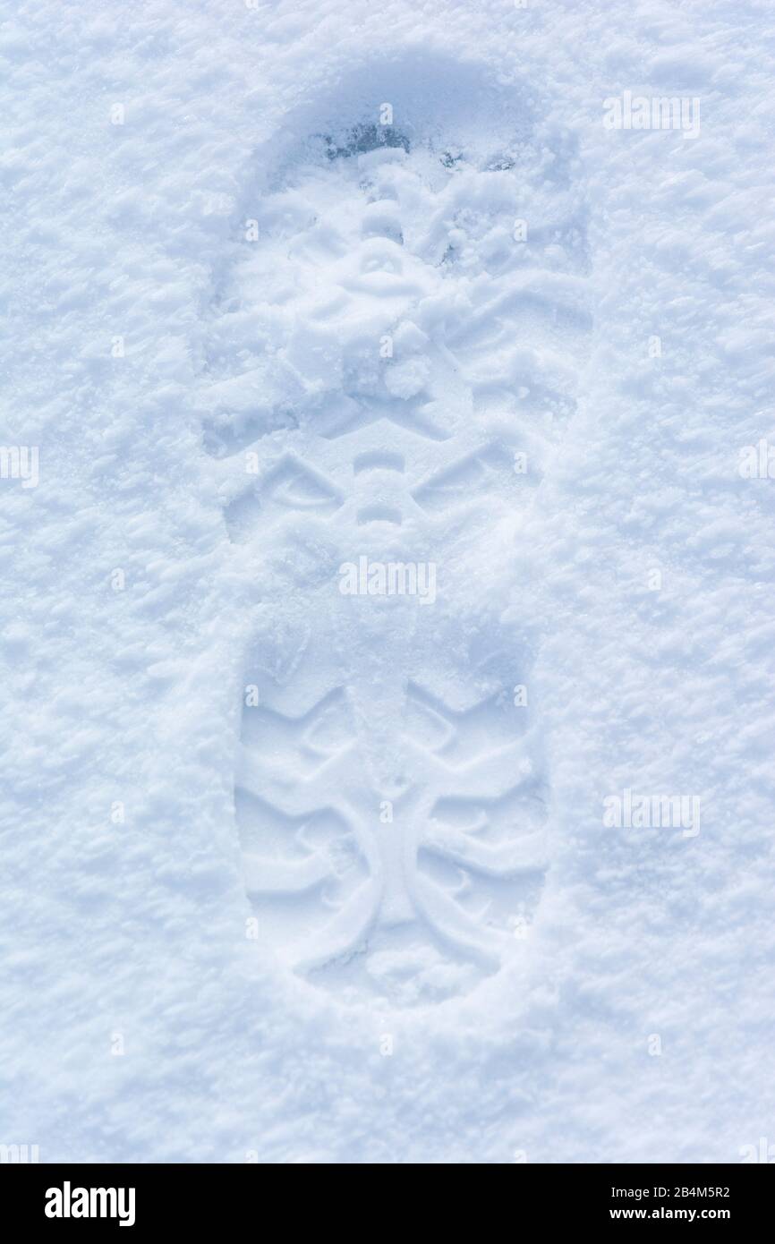 Shoe print in the snow Stock Photo - Alamy