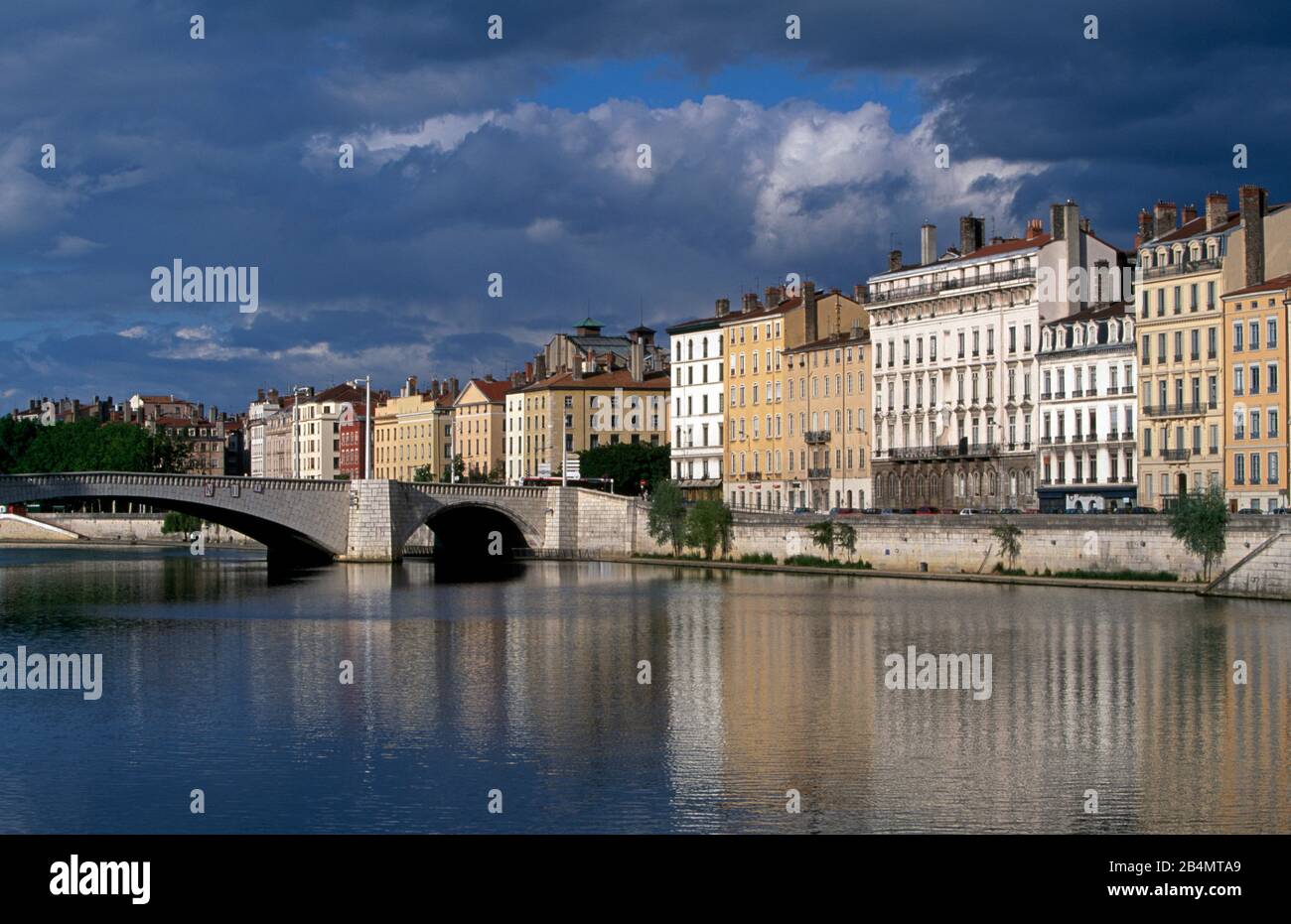 Buildings on the riverside with the Pont Bonaparte bridge over the ...