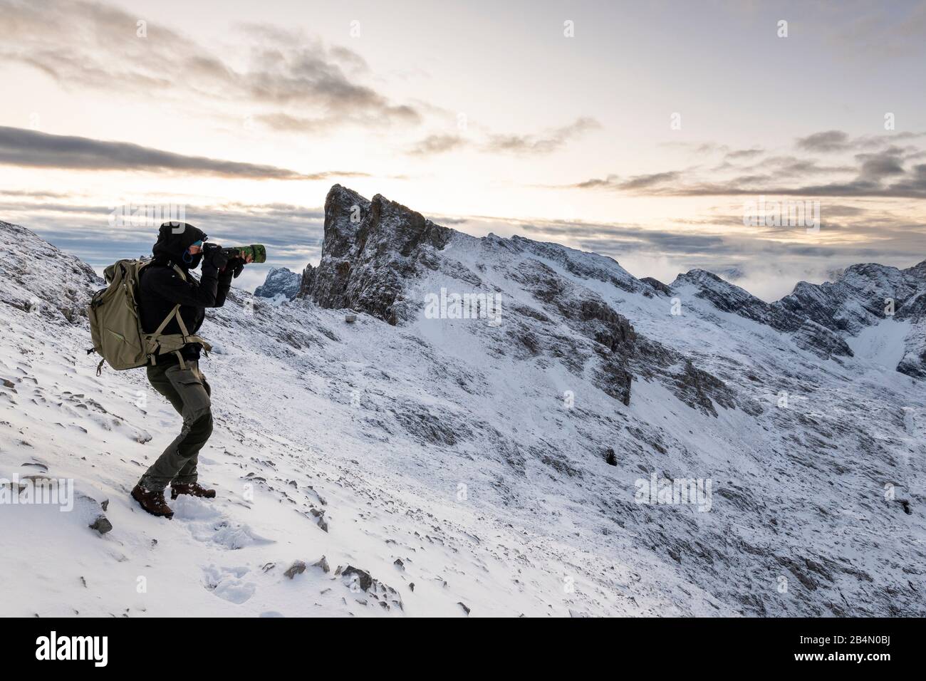 Self-portrait nature photographer in the high mountains of the ...