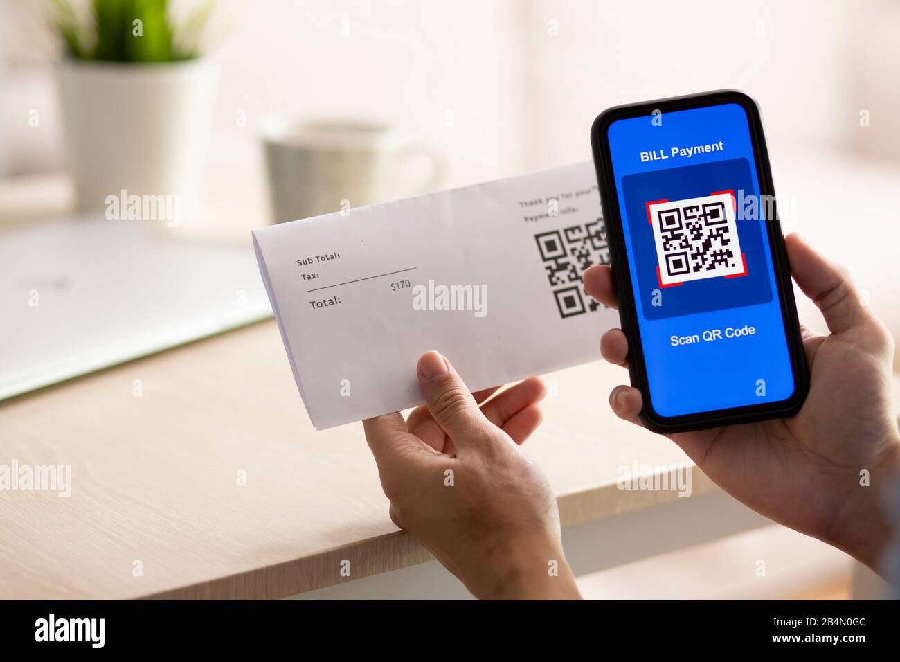 Using Smartphone Scanning QR Code for bill payment option Stock Photo ...