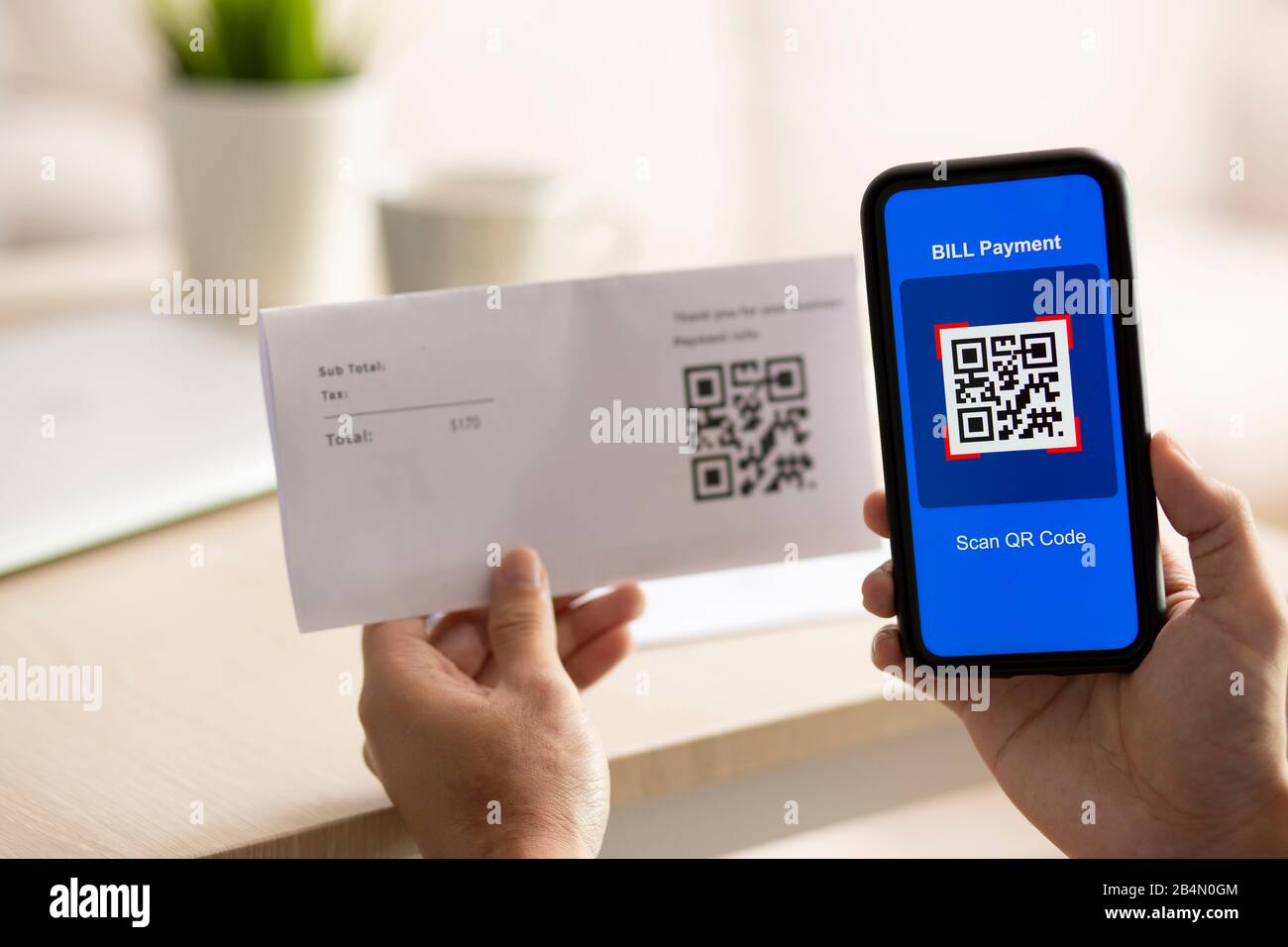 Using Smartphone Scanning QR Code for bill payment option Stock Photo ...