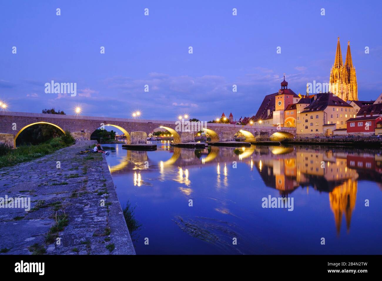 Stone bridge over danube and old town with cathedral hi-res stock ...