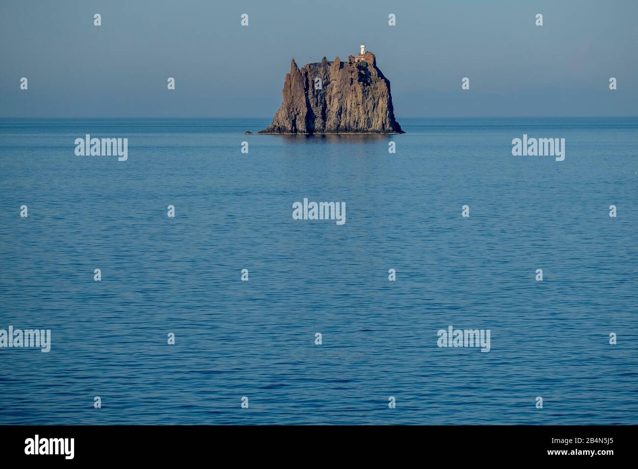 Strombolicchio, the tower-like cliff in front of the Stromboli volcano ...