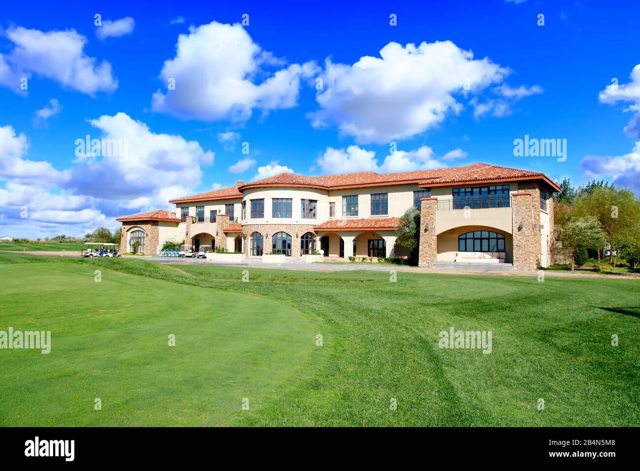 Golf course landscape, blue sky and white clouds Stock Photo - Alamy