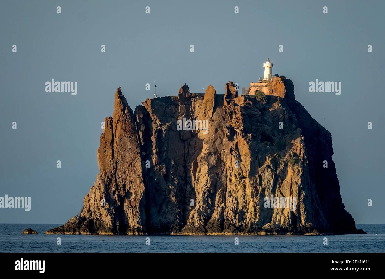 Strombolicchio, the tower-like cliff in front of the Stromboli volcano ...