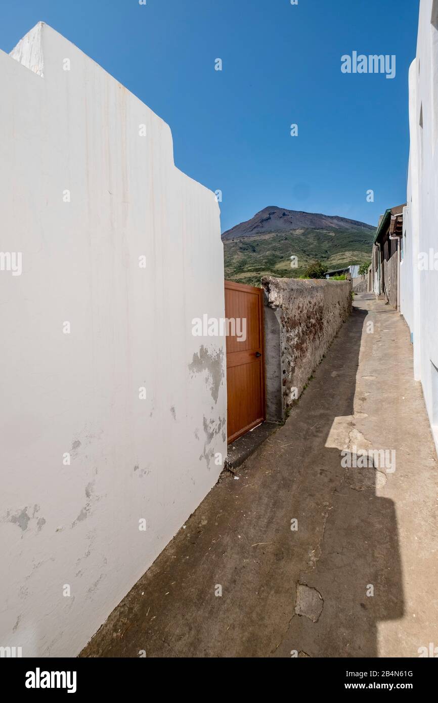 Alley with a view to Stromboli volcano, Stromboli, Aeolian Islands ...