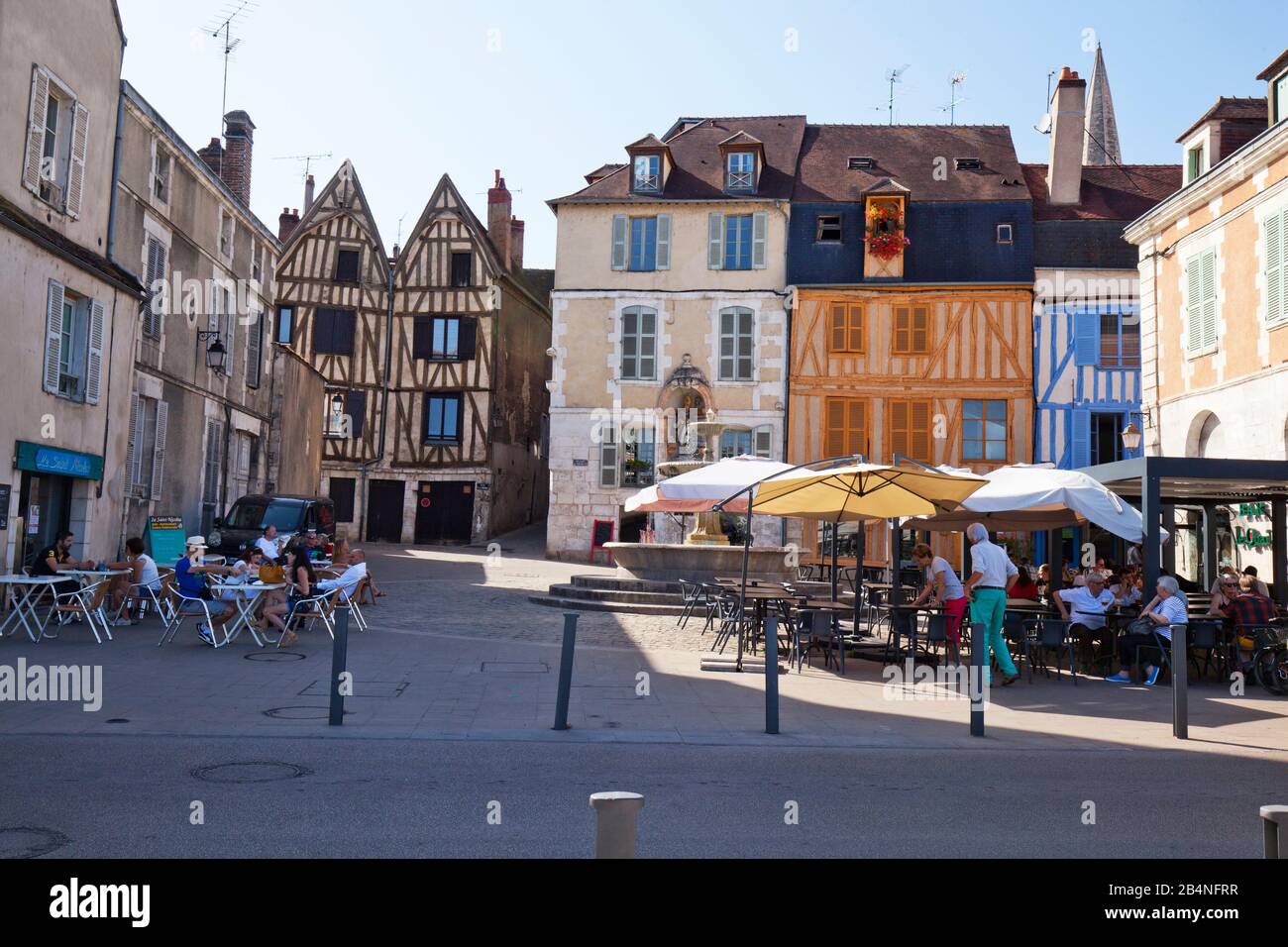 Street cafes and half-timbered houses characterize the old town in ...