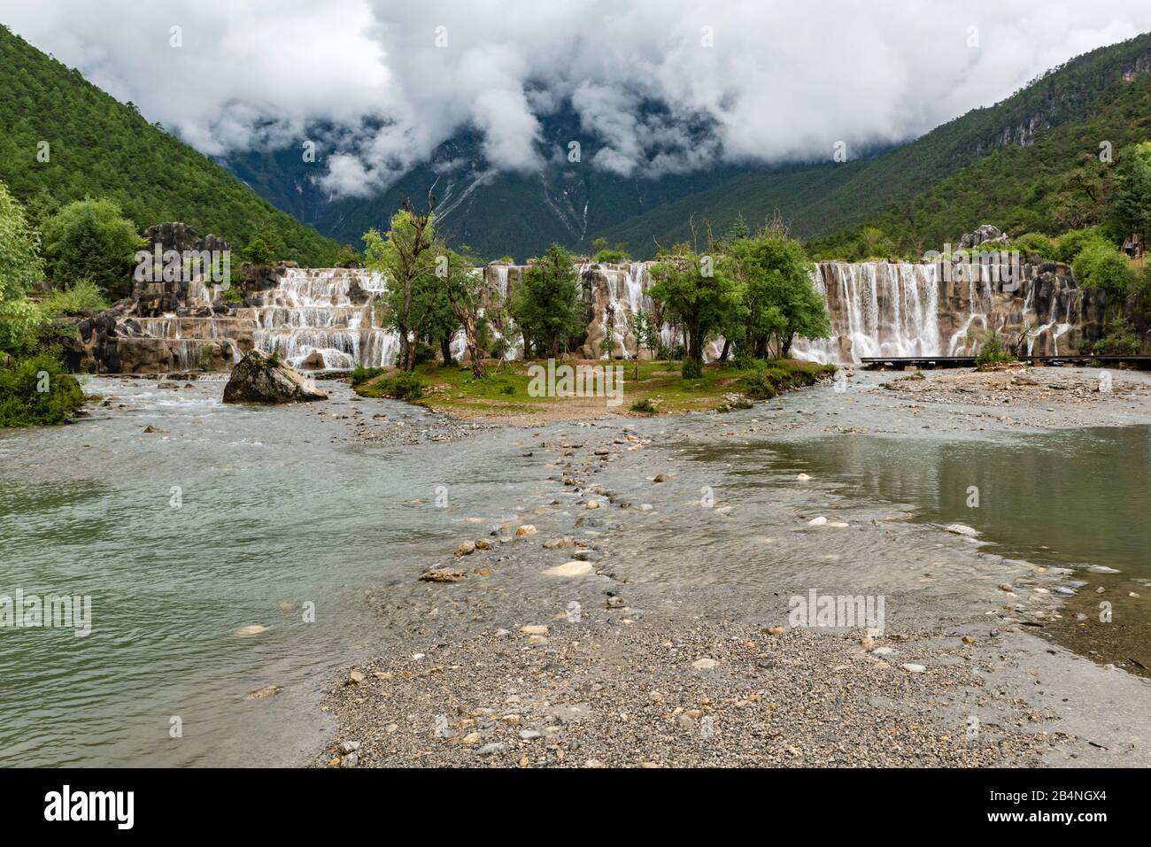Emerald color waterfalls at Blue Moon Valley at the foot of Jade Dragon ...