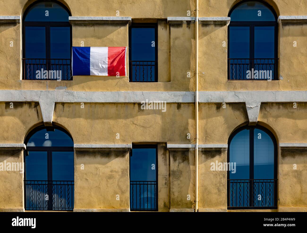 French flag on a building facade in Marseille Stock Photo - Alamy