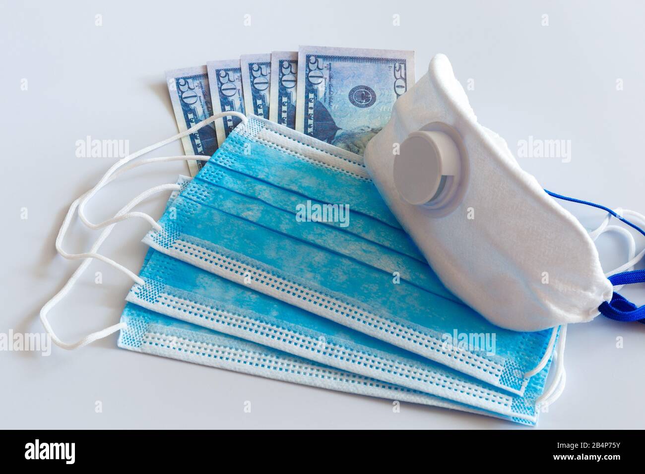 Medical masks and 50 dollars bills as a symbol of increased prices for ...