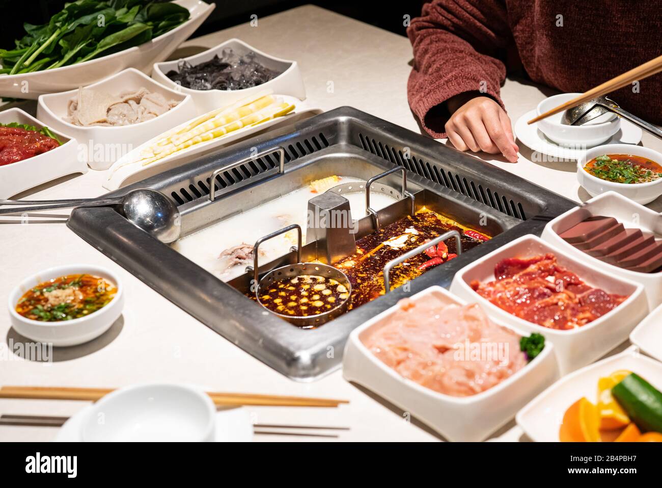 Chinese Hotpot shabu spicy and sour soup with meat and seafood, Suki ...