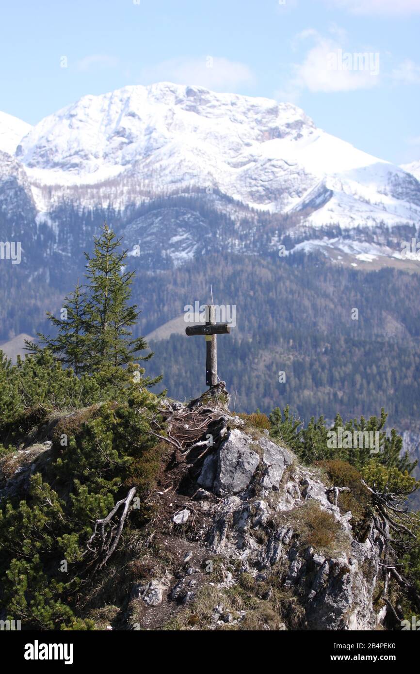 Small peak with a cross in front of snowy mountain Stock Photo - Alamy