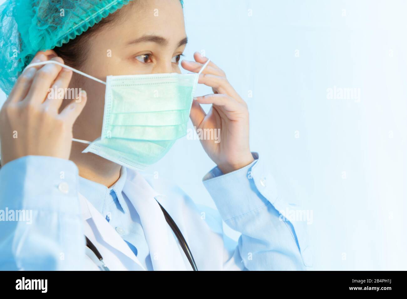 Coronavirus stop infection. young female doctor wearing mask with ...