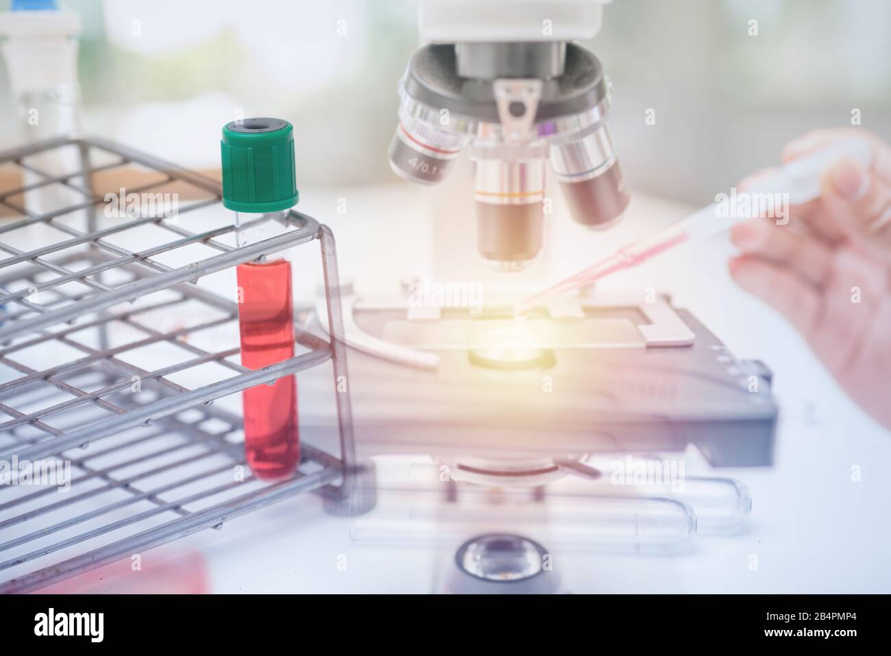 Microscope on the table in laboratory room with laboratory equipment ...