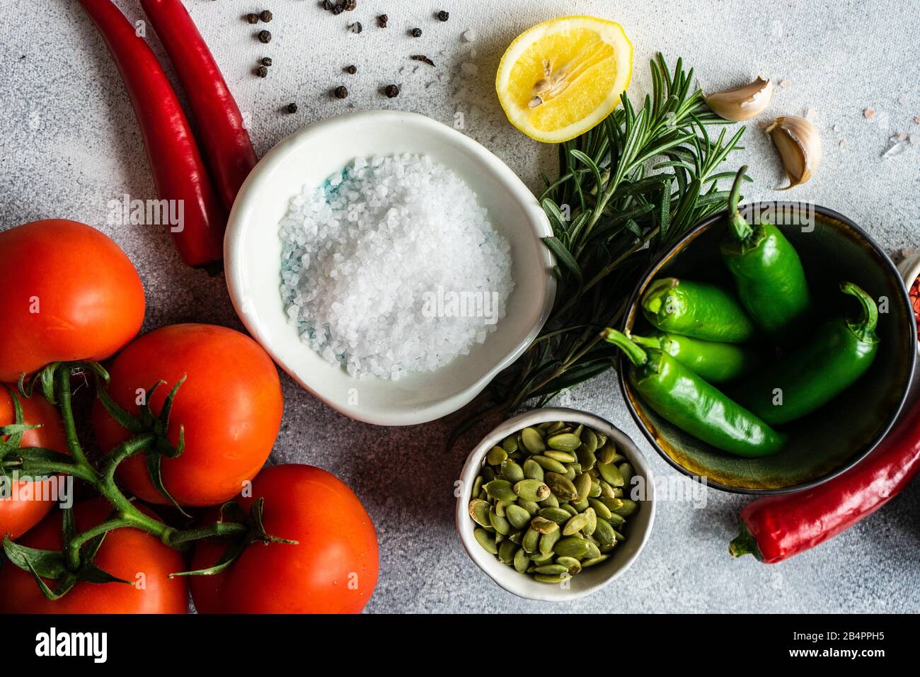 Organic food frame with spices and vegetables on stone background with ...