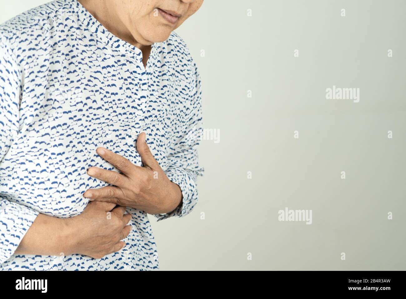 Senior woman Suffering From Acid Reflux Or Heartburn-Isolated On White ...