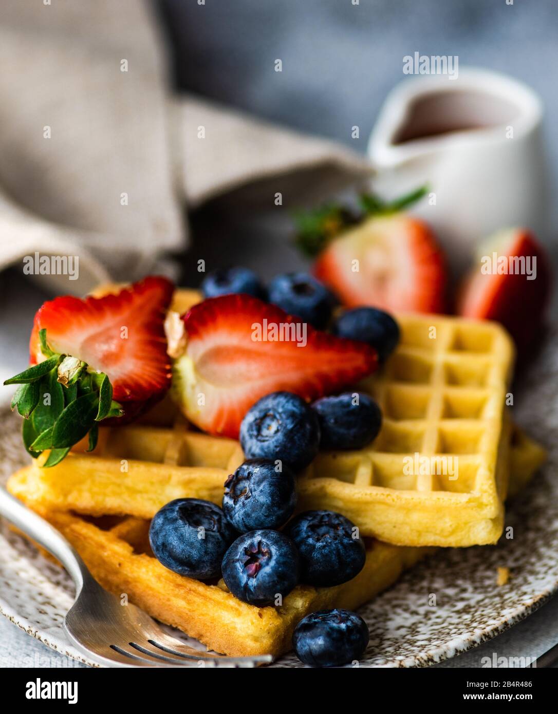 Traditional european breakfast with waffles, organic strawberry and ...