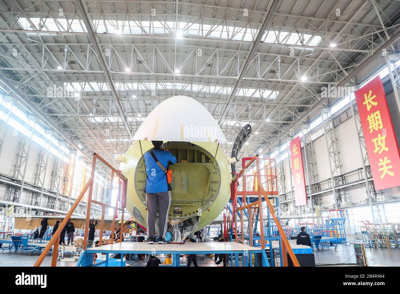 Shanghai, China. 6th Mar, 2020. Technicians work on the manufacturing ...