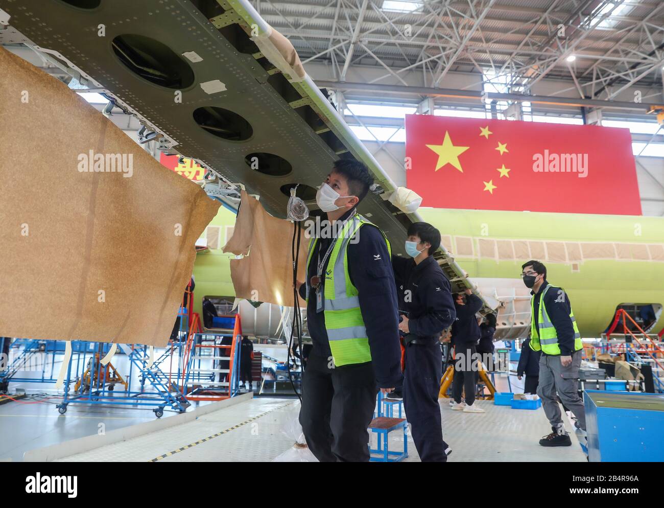 Shanghai, China. 6th Mar, 2020. Technicians work on the manufacturing ...