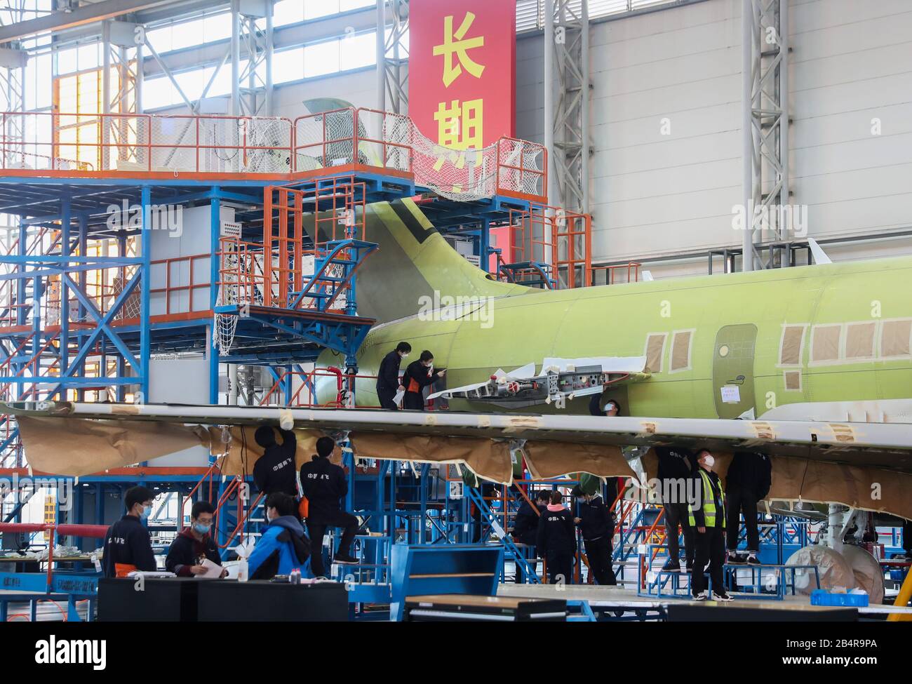 Shanghai, China. 6th Mar, 2020. Technicians work on the manufacturing ...