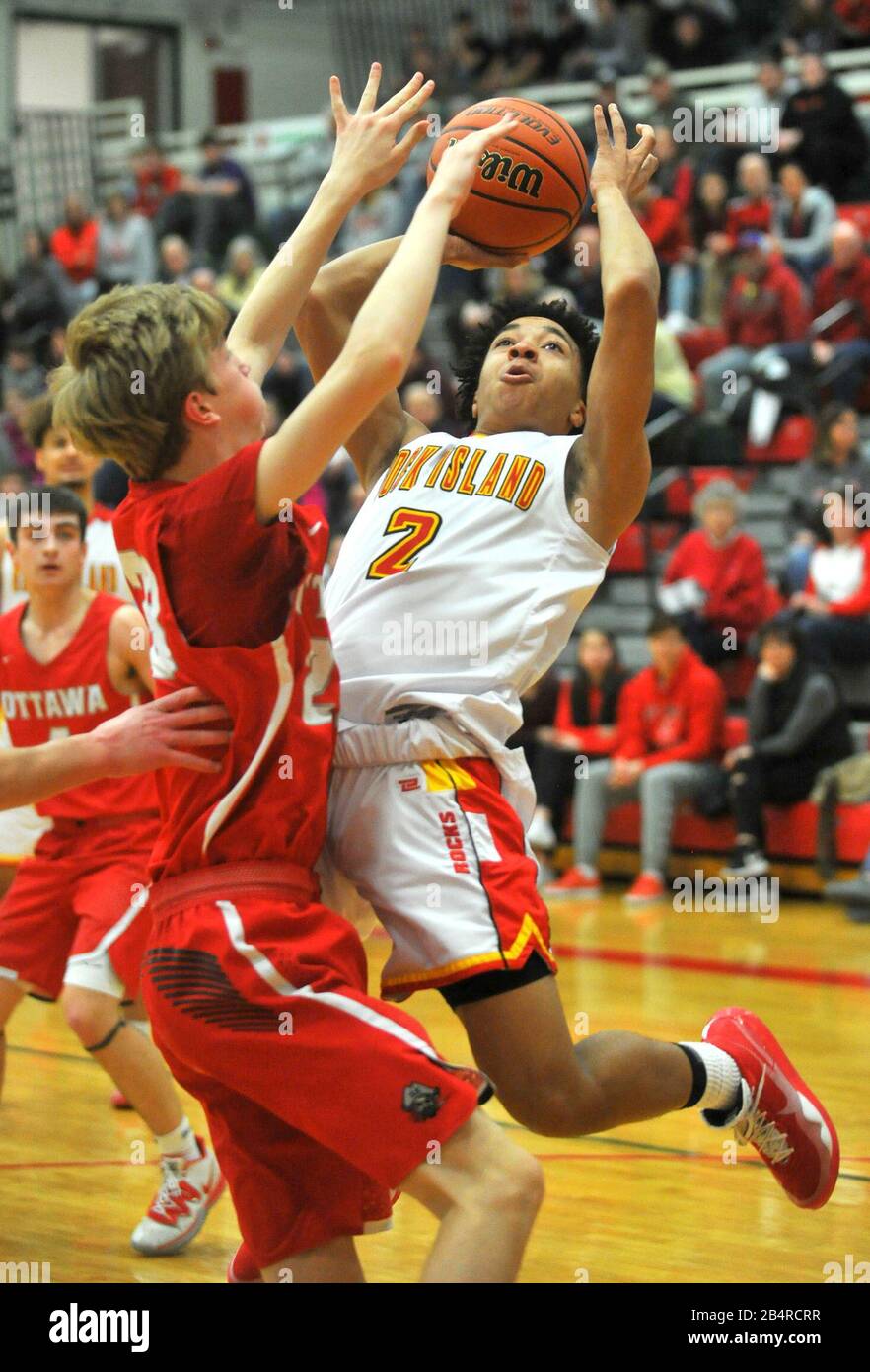 Iowa, USA. 6th Mar, 2020. Rock Island's Jordan Rice takes a shot under ...