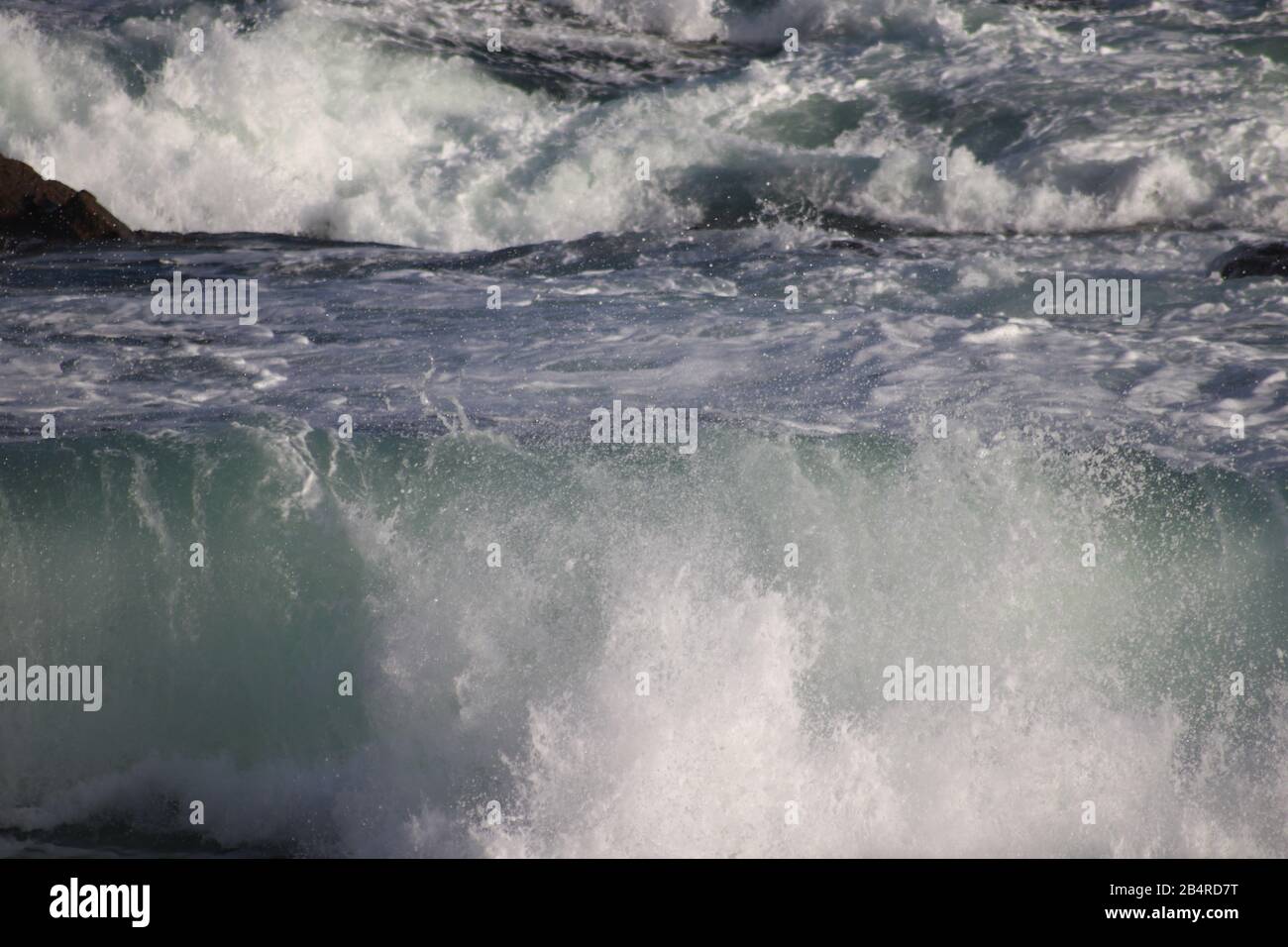 Wave breaking with surf Stock Photo - Alamy