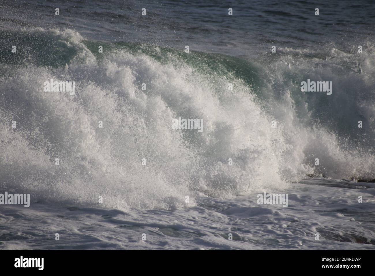 Wave breaking with surf Stock Photo - Alamy