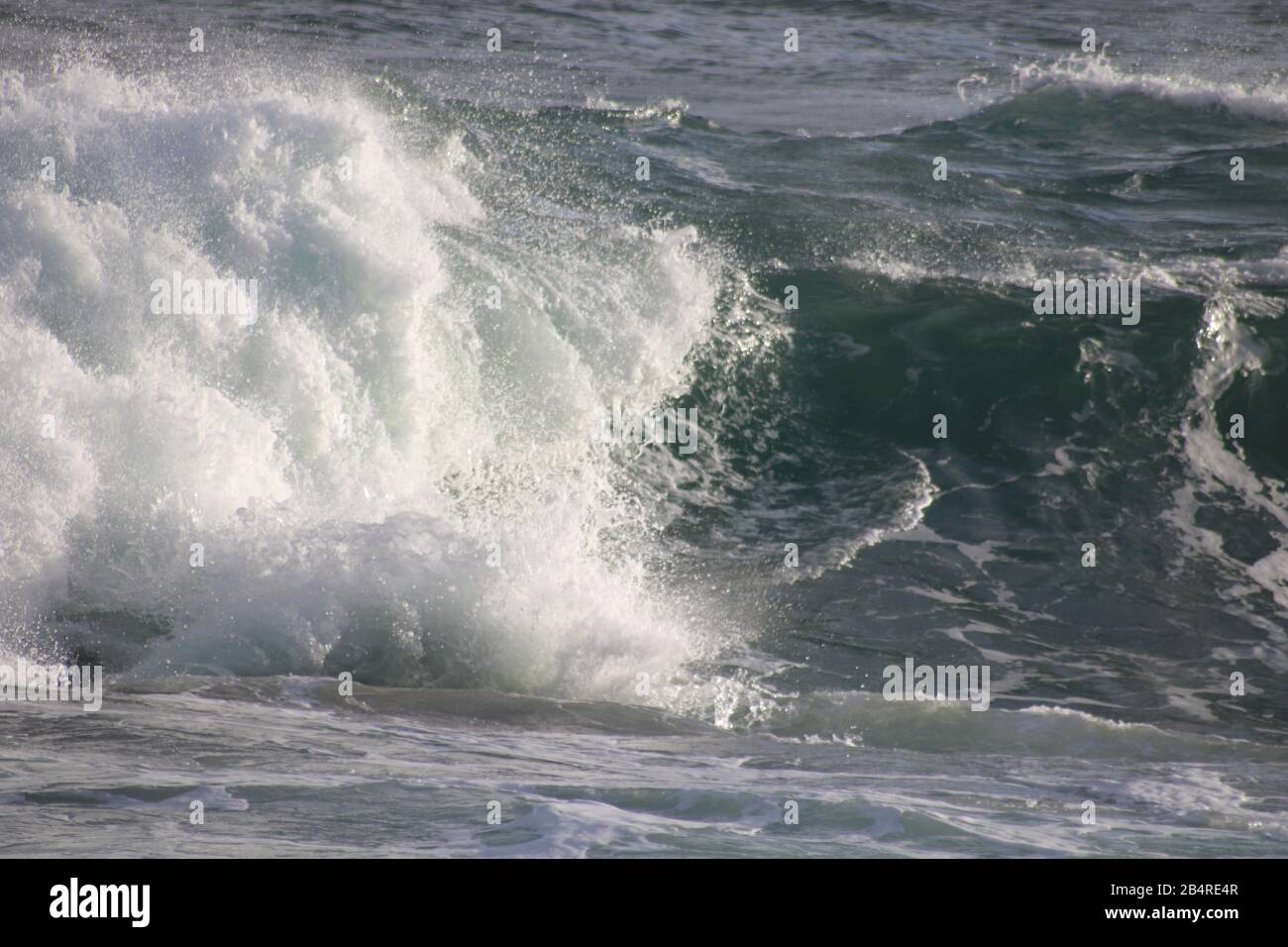 Wave breaking with surf Stock Photo - Alamy