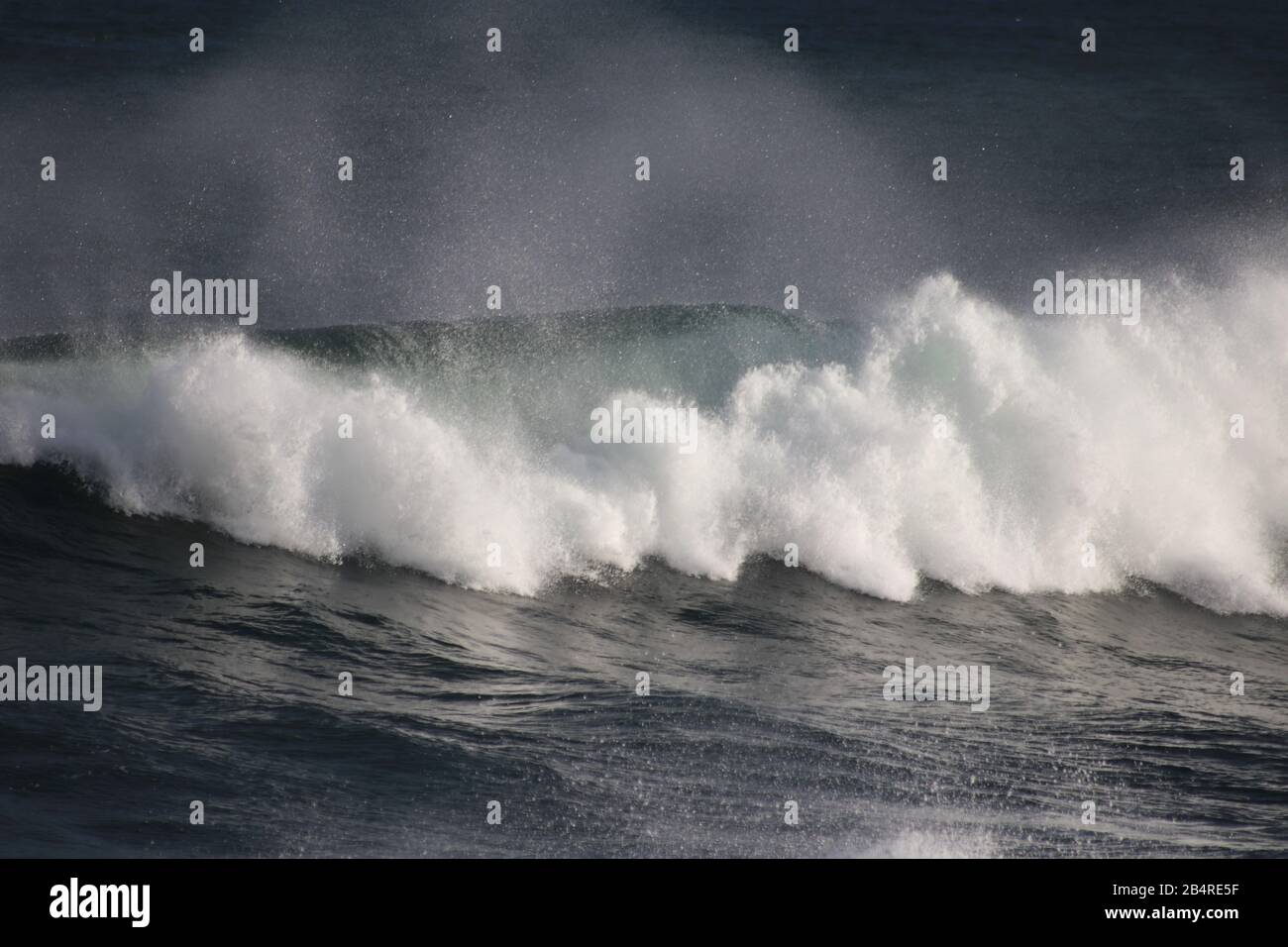Wave breaking with surf Stock Photo - Alamy