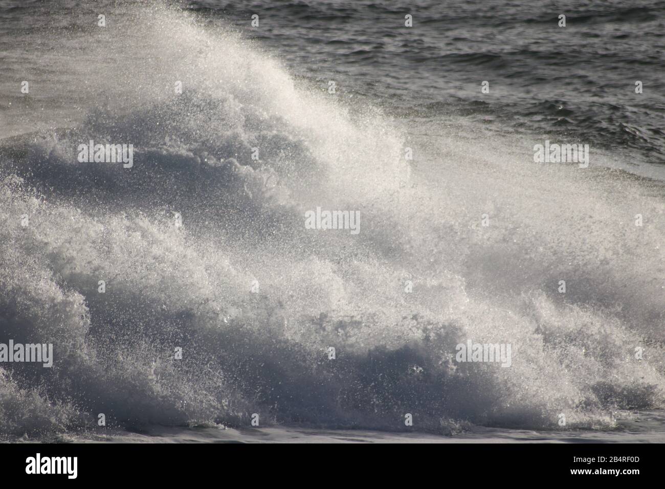 Wave breaking with surf Stock Photo - Alamy
