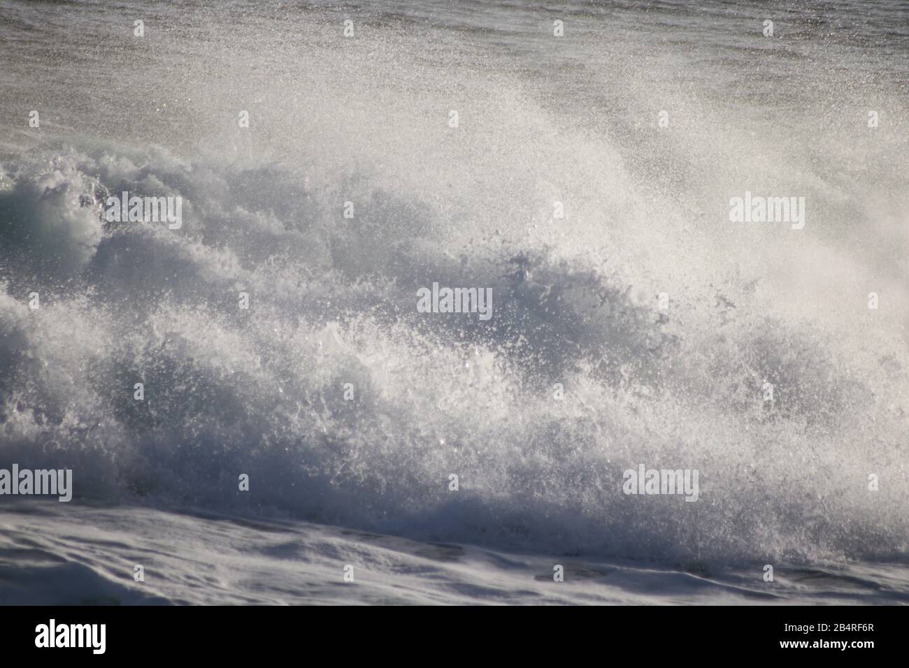 Wave breaking with surf Stock Photo - Alamy